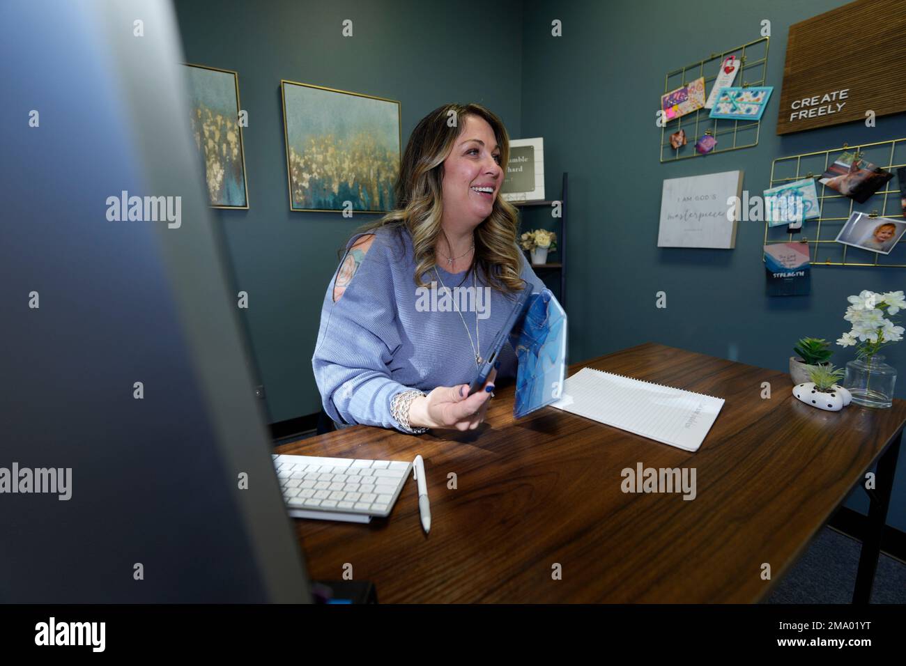 Web designer Lorie Smith poses in her office on Monday, Nov. 7, 2022 ...