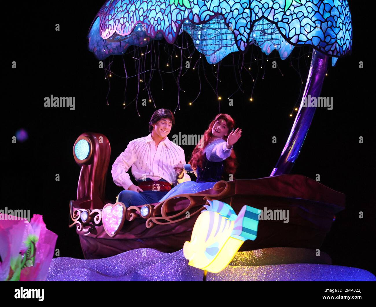 Disney characters perform on a float on the water at a press preview of ...