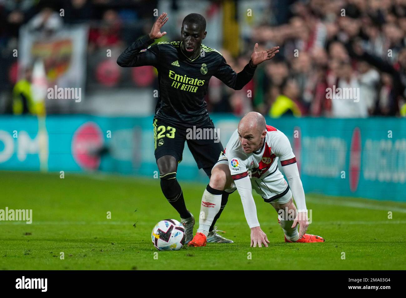 Real Madrid's Ferland Mendy, left, tussles for the ball with Rayo's Isi ...