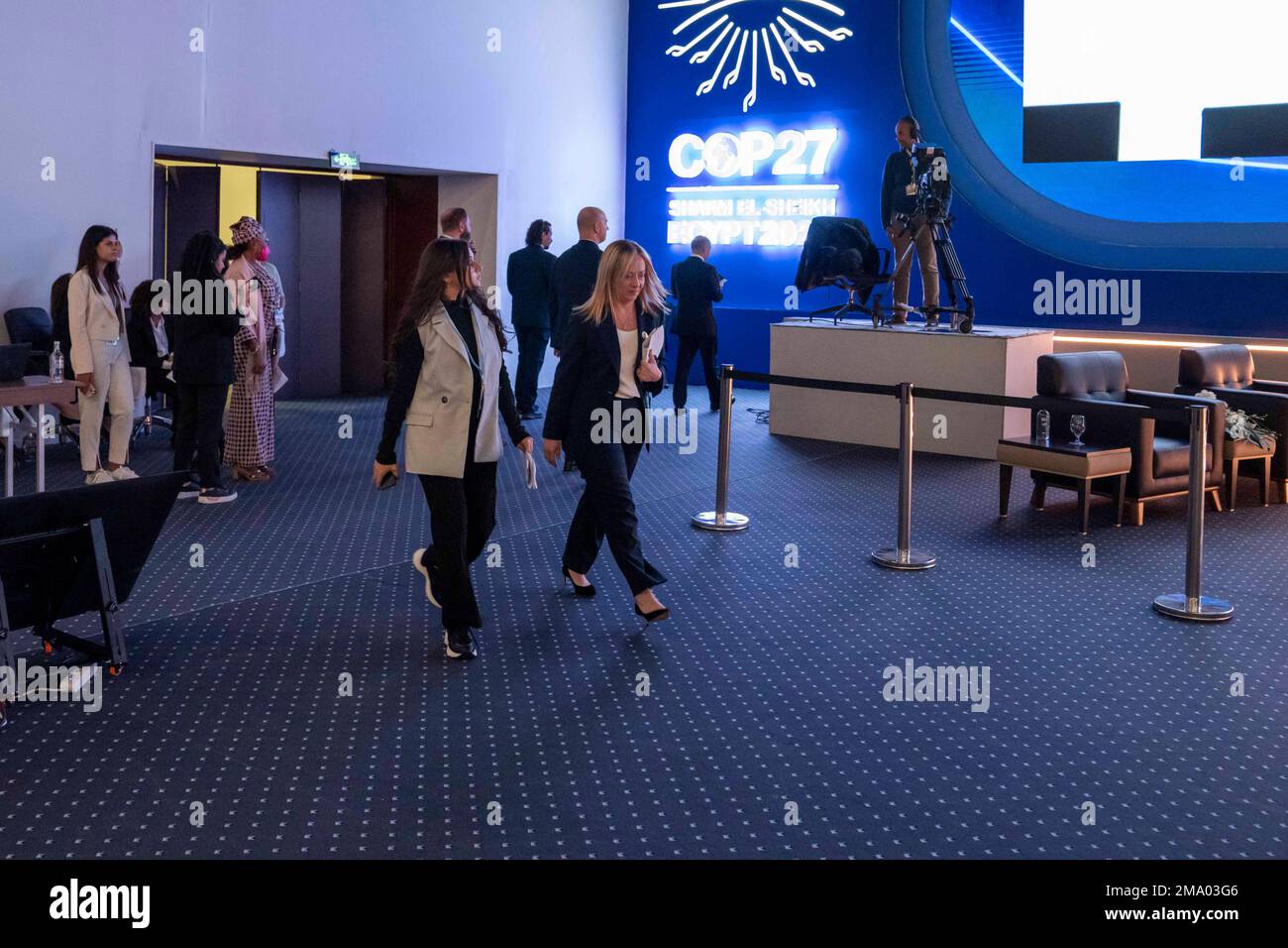 Italian Prime Minister Giorgia Meloni, center, leaves the stage after ...