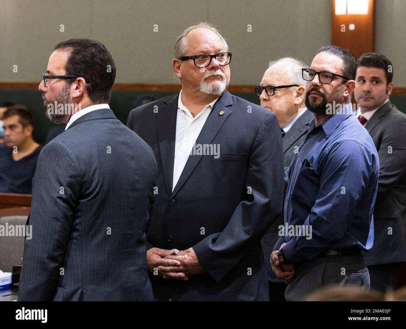 Hells Angels President Richard Devries, center, his attorney, Richard Schonfeld, left, and ...