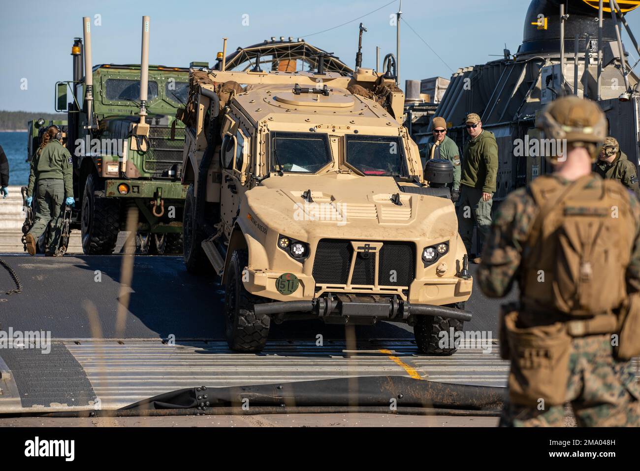 A U.S. Marine Joint Light Tactical Vehicle (JLTV) offloads from a U.S ...