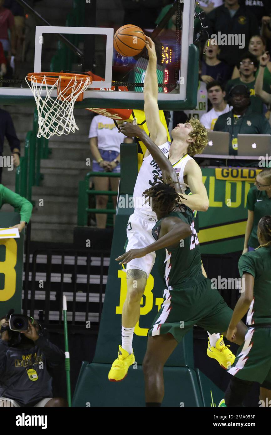 Baylor forward Caleb Lohner (33) is fouled while attempting to score ...
