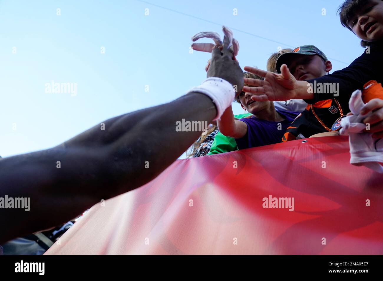 Cincinnati Bengals safety Michael Thomas gives a fan gloves following ...