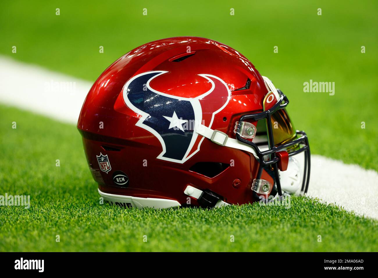 A Houston Texans red helmet sits on the field during pregame warmups before an NFL Football game ...