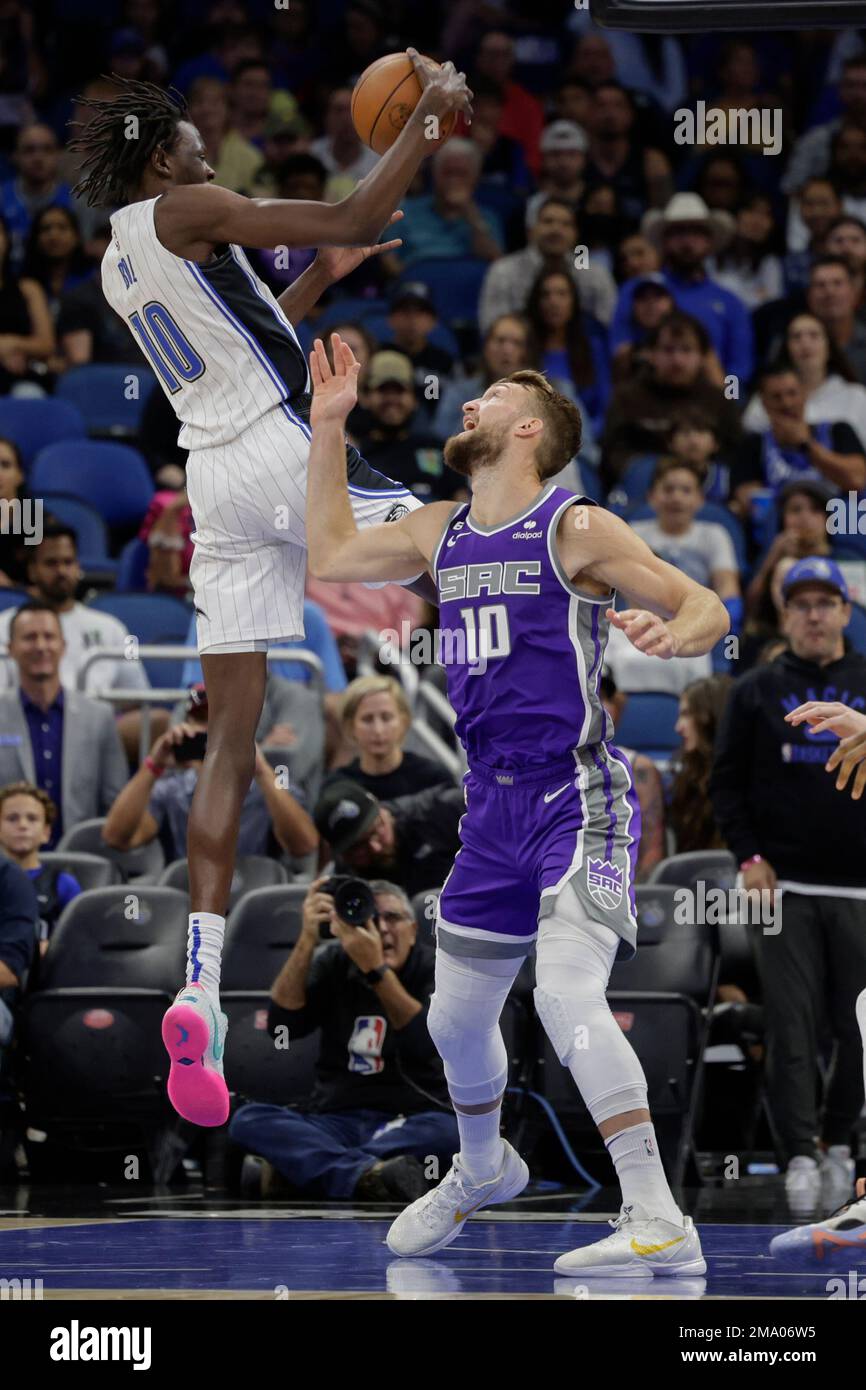 Orlando Magic center Bol Bol (10) pulls down a rebound against Sacramento Kings forward Domantas ...