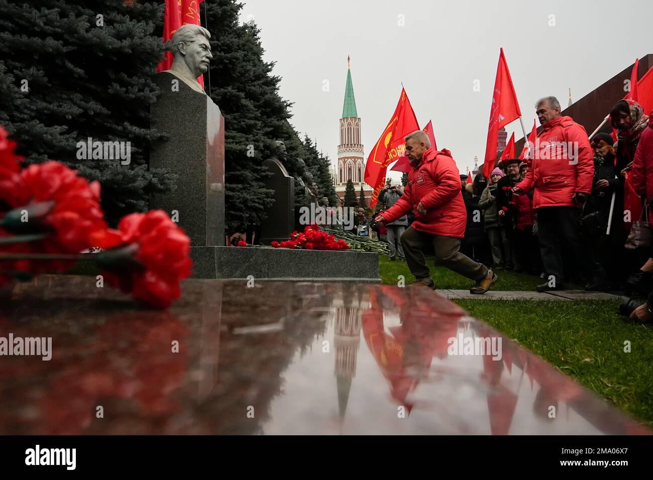 Communist party supporters lay flowers at the grave of Soviet leader ...