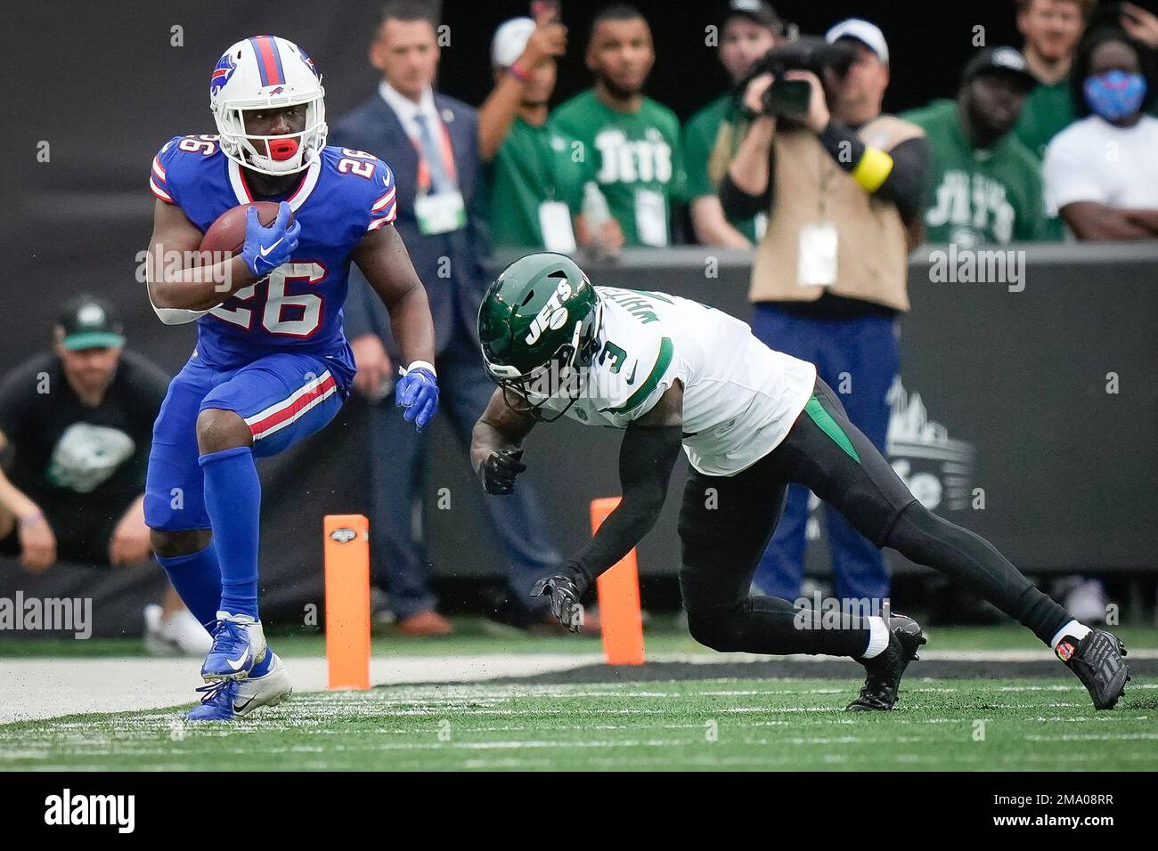 Buffalo Bills running back Devin Singletary (26) avoids the tackle of ...