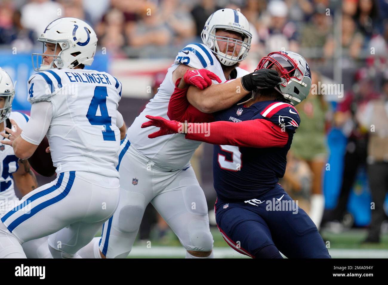 Indianapolis Colts offensive tackle Braden Smith, center, tries to hold ...