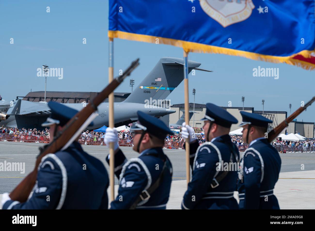 Members of the Dover Air Force Base Honor Guard present the colors ...