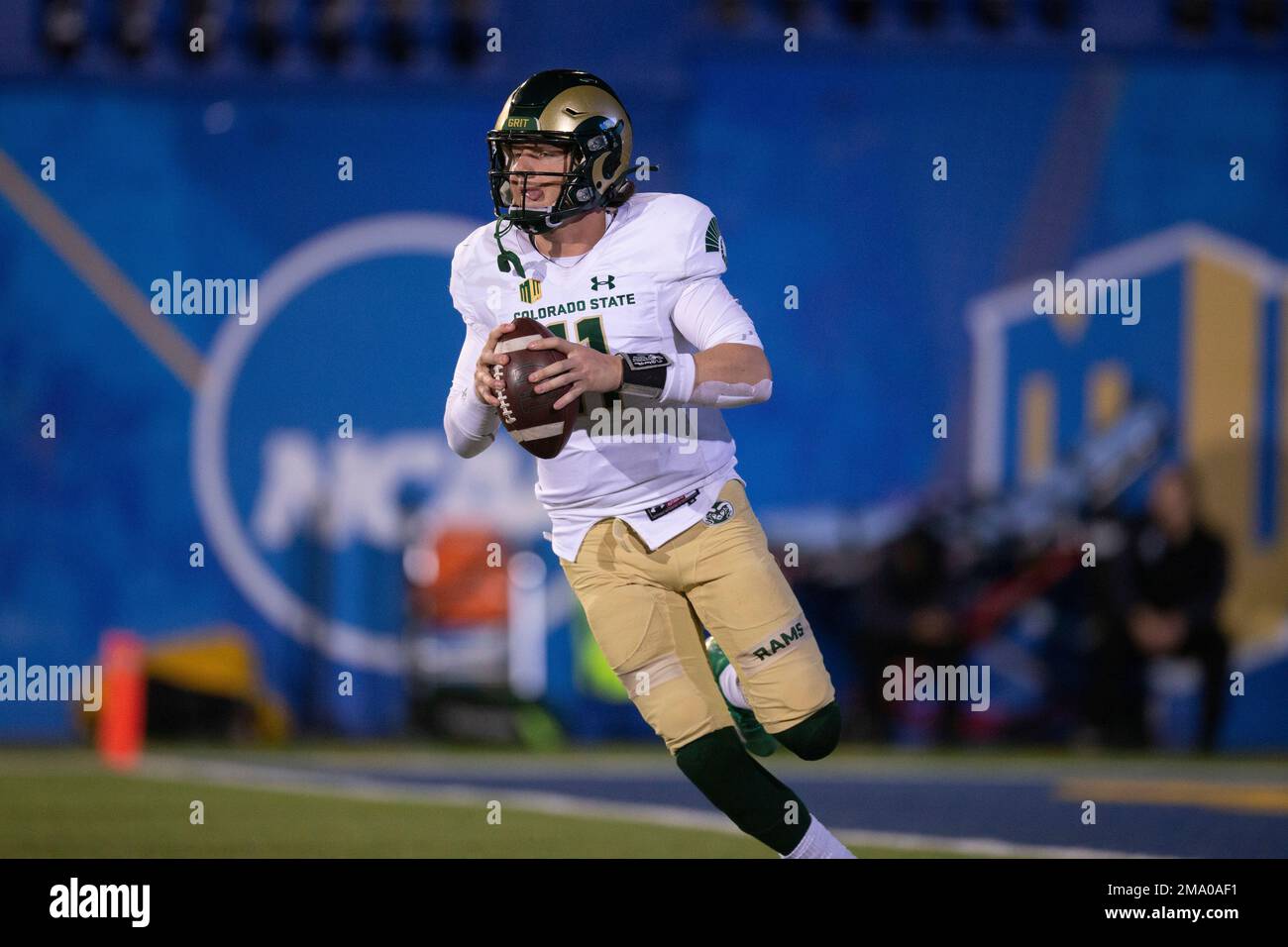 Colorado State quarterback Clay Millen (11) rolls out to pass against ...