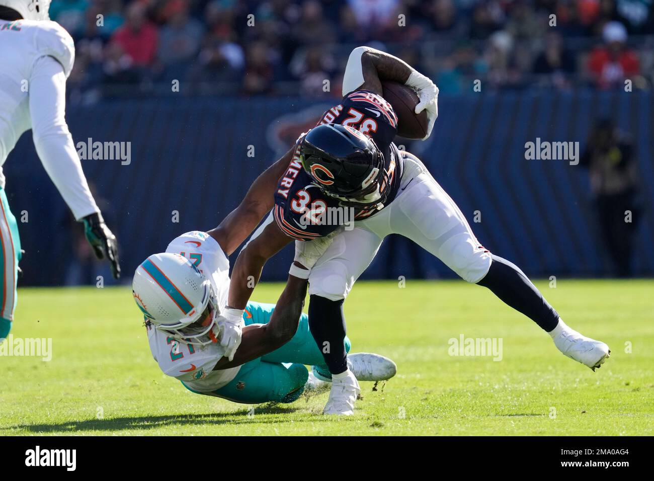 Chicago Bears running back David Montgomery, right, runs as Miami Dolphins safety Eric Rowe ...