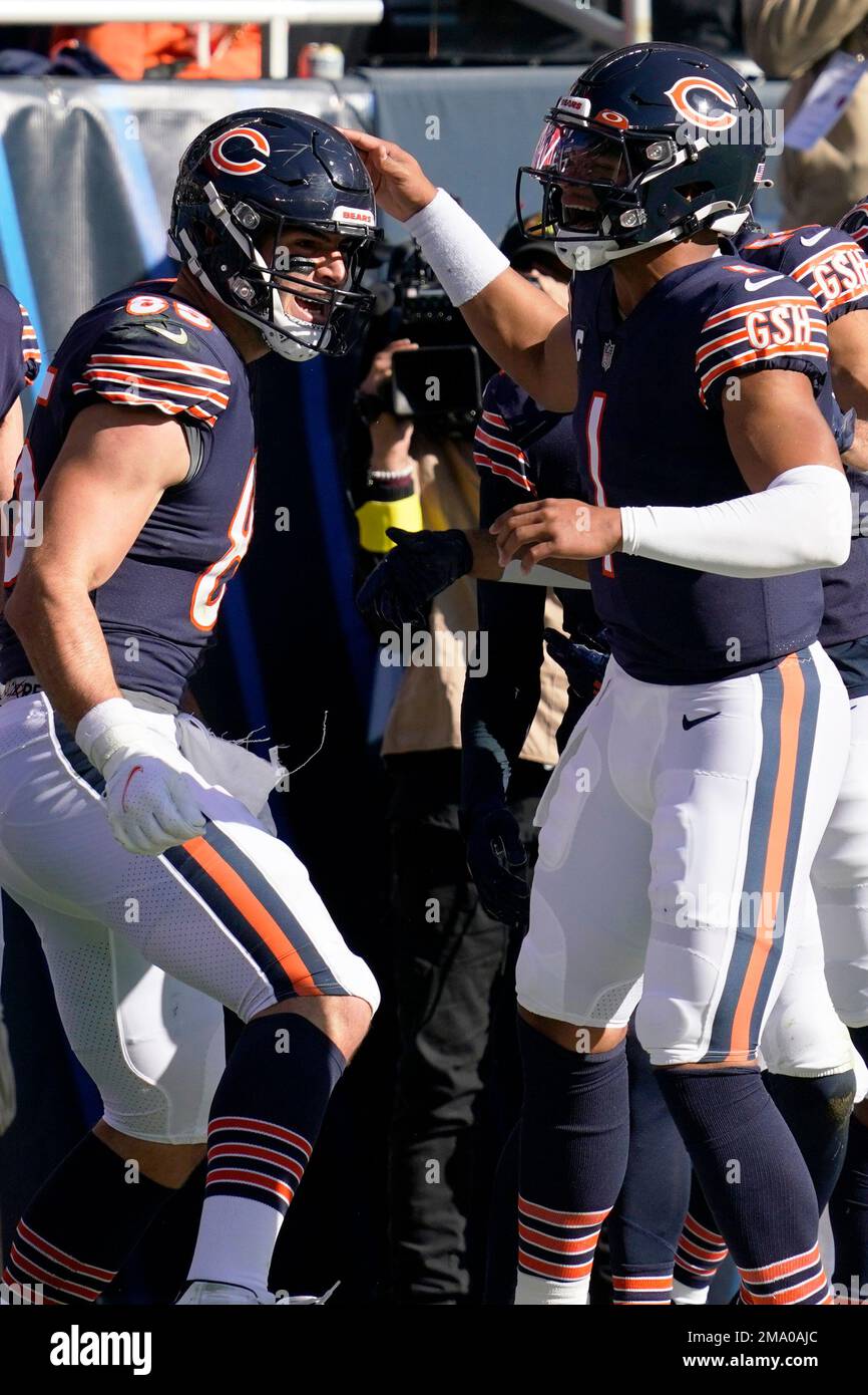 Chicago Bears tight end Cole Kmet, left, celebrates with quarterback ...