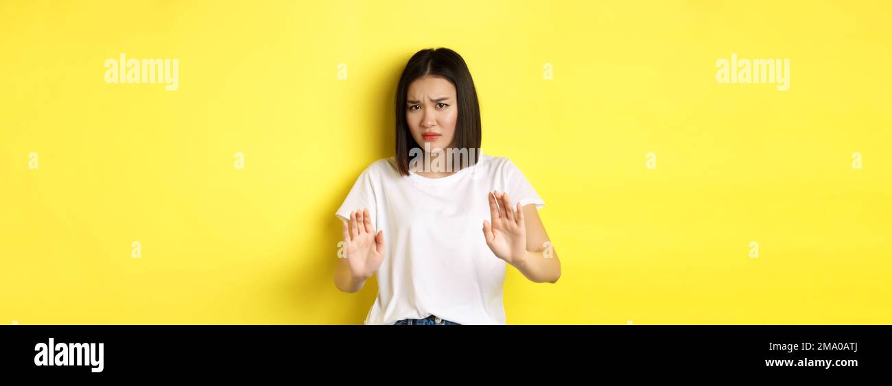 Please no. Asian woman, victim of assualt or domestic abuse, pleading ...