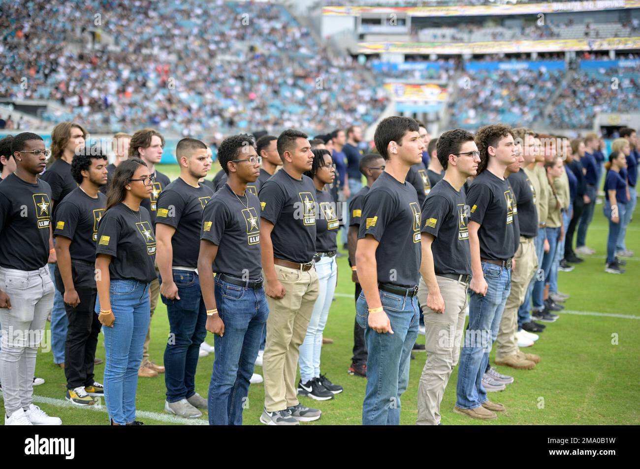 Military recruits are sworn in during halftime on Salute to Service ...