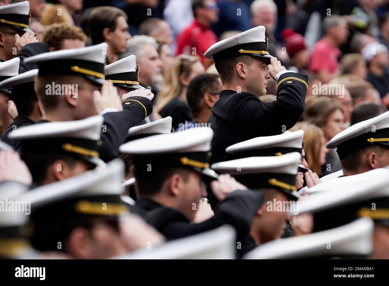 Navy midshipmen attend an NCAA college football game against Cincinnati ...