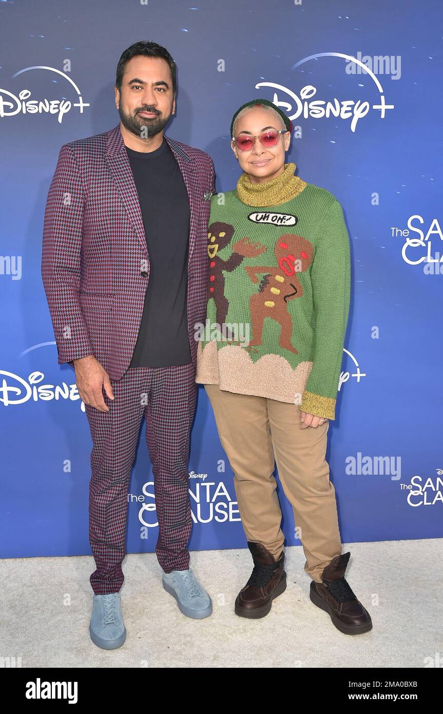 Kal Penn,left, and Raven-Symone arrive at the premiere of "The Santa ...