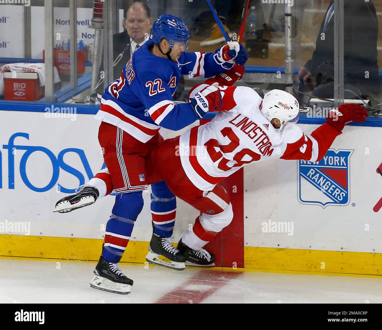 New York Rangers center Ryan Carpenter, left, checks Detroit Red Wings ...