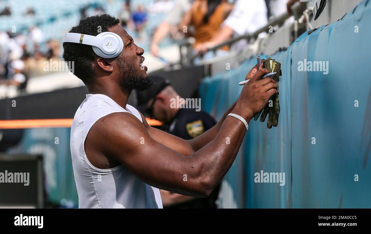 Las Vegas Raiders cornerback Sam Webb (27) signs an autograph during ...