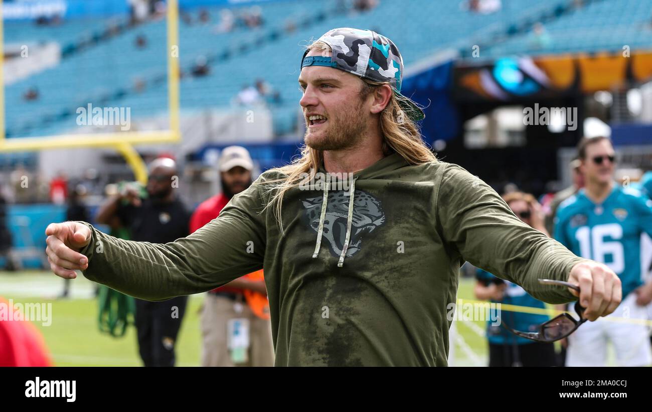 Jacksonville Jaguars safety Andrew Wingard (42) greets a fan during ...