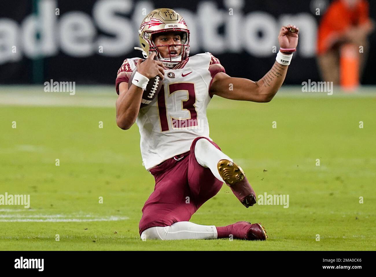 Florida State quarterback Jordan Travis (13) runs for a first down ...