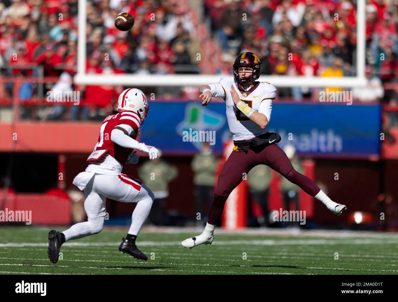 Minnesota quarterback Athan Kaliakmanis, right, passes the ball against ...