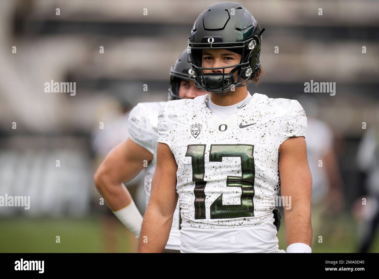 Oregon quarterback Ty Thompson (13) warms up before an NCAA college ...