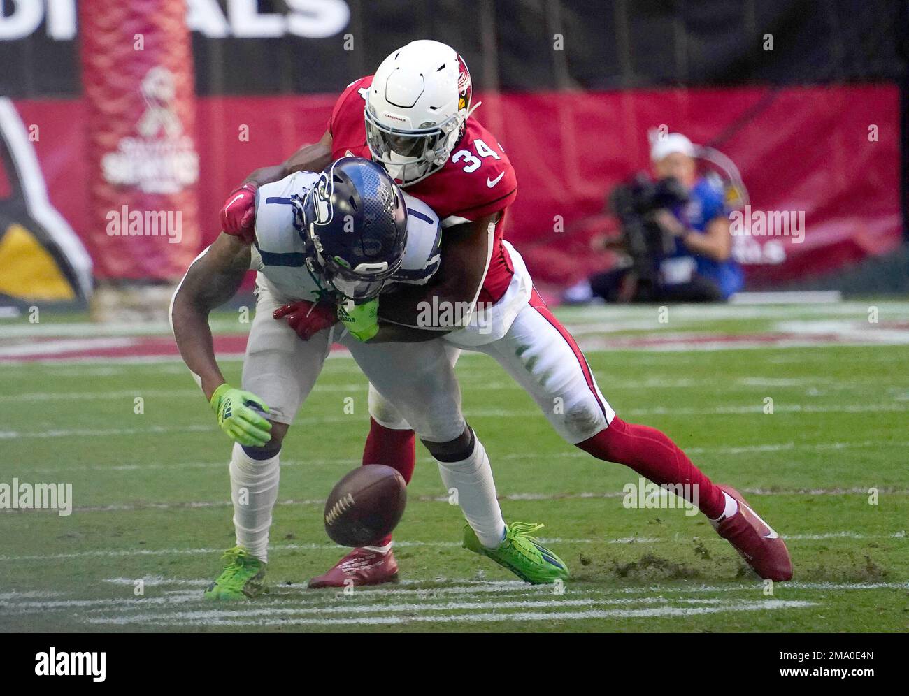 Arizona Cardinals' Jalen Thompson (34) knocks the ball away from ...