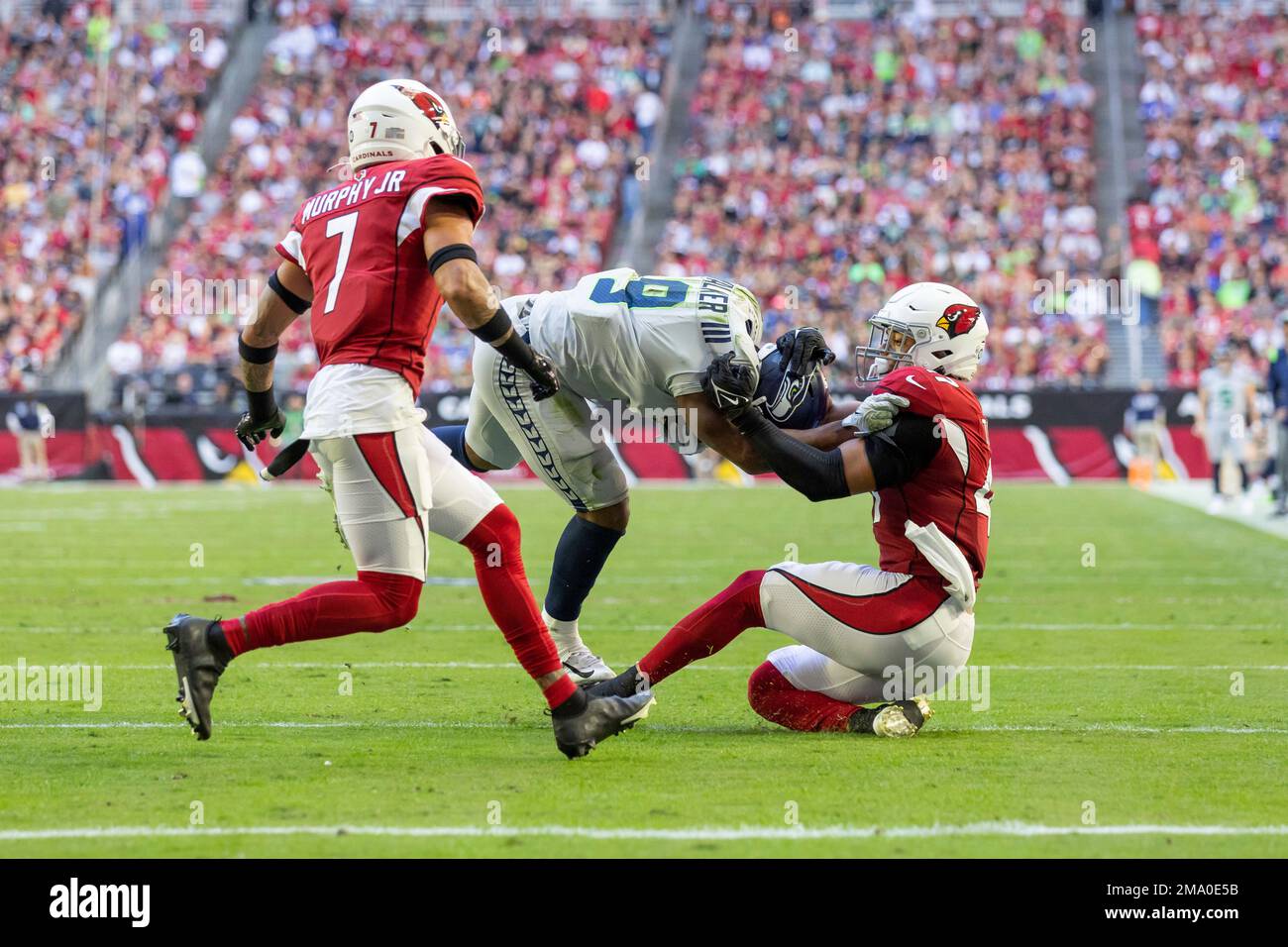 Arizona Cardinals linebacker Ezekiel Turner (47) tackles Seattle Seahawks running back Kenneth ...
