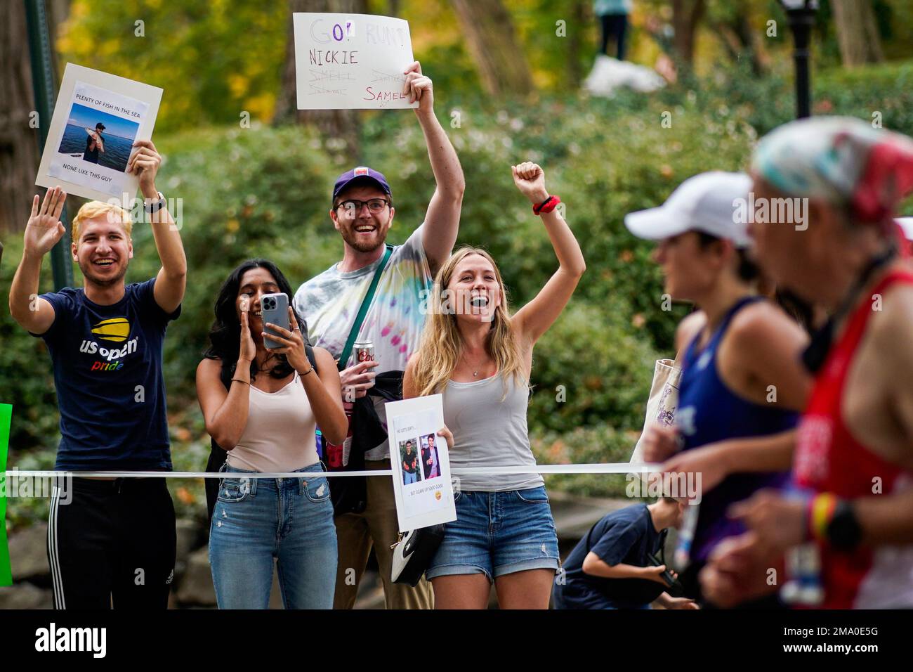 People cheer runners on during the New York City Marathon along Central ...