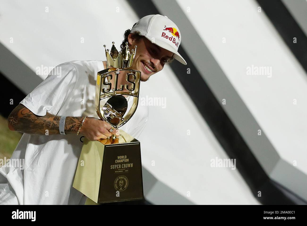 Gustavo Ribeiro, of Portugal, holds the trophy after winning the Street ...