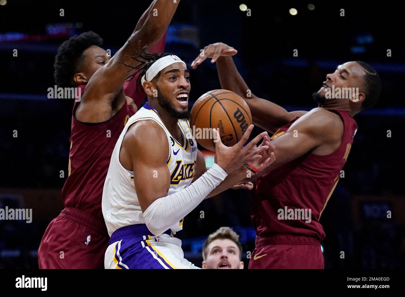 Los Angeles Lakers forward Troy Brown Jr., center, works for a rebound ...