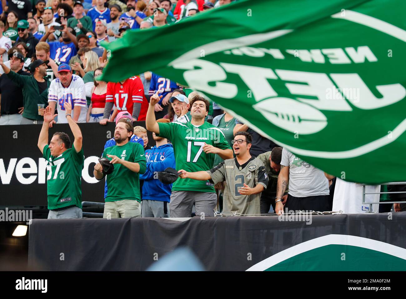New York Jets fans cheer during the second half of an NFL football game ...