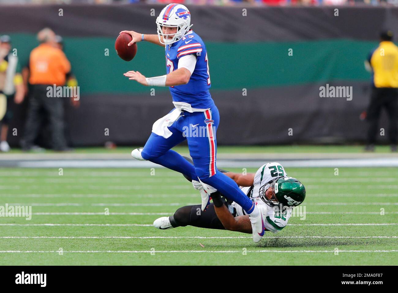 New York Jets' Jermaine Johnson (52) tackles Buffalo Bills quarterback ...