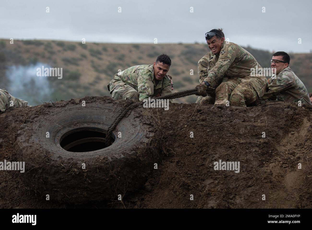 Soldiers assigned to the 4th Infantry Division pulls a 335-pound tire ...