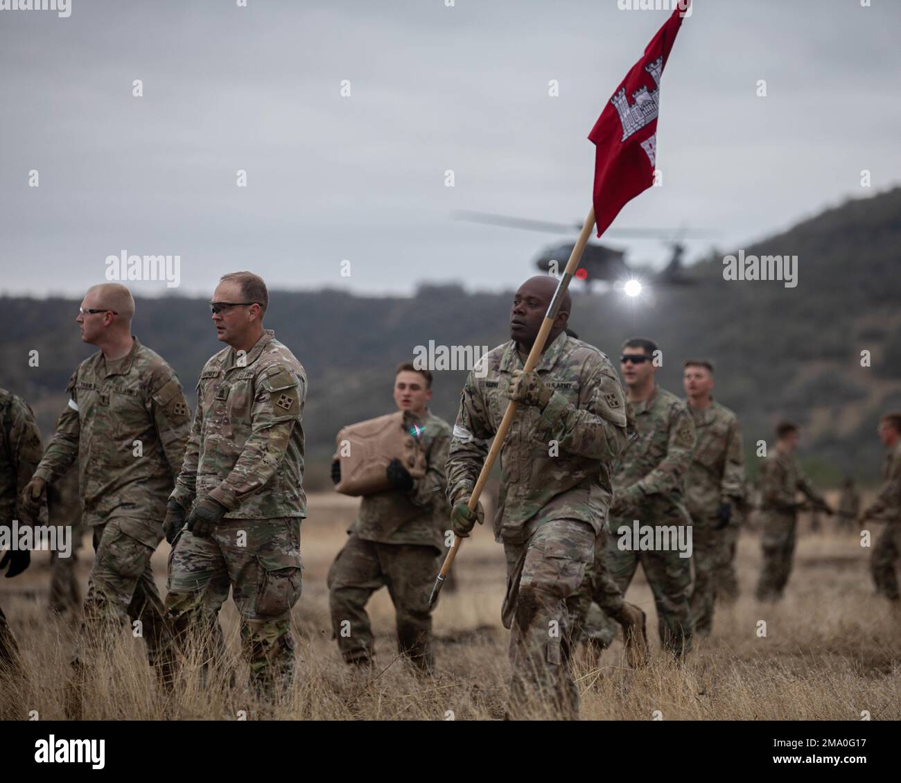 Soldiers assigned to the 4h Infantry Division run with their units ...