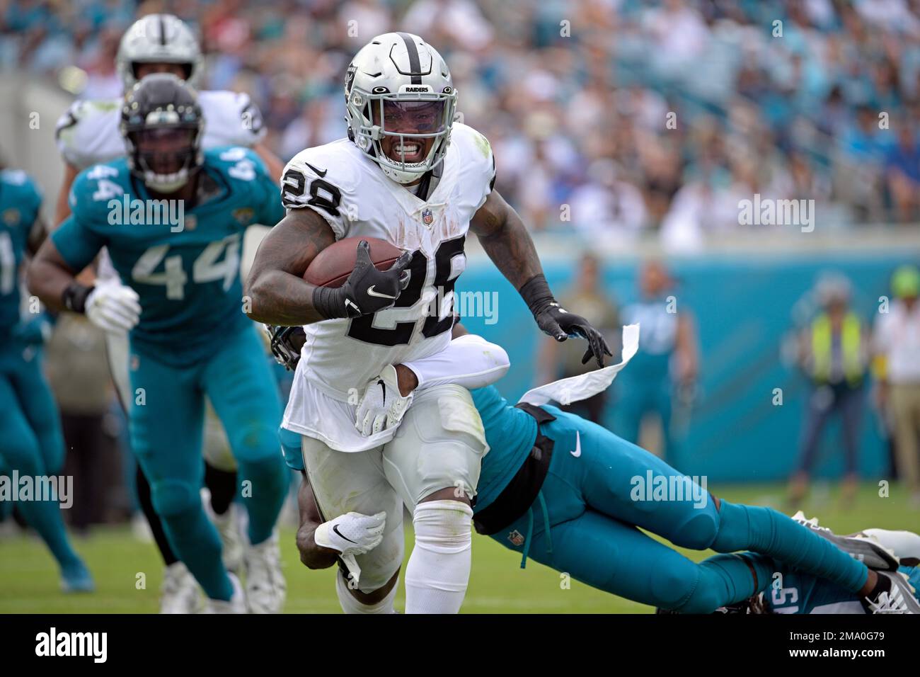 Las Vegas Raiders running back Josh Jacobs (28) is stopped by ...