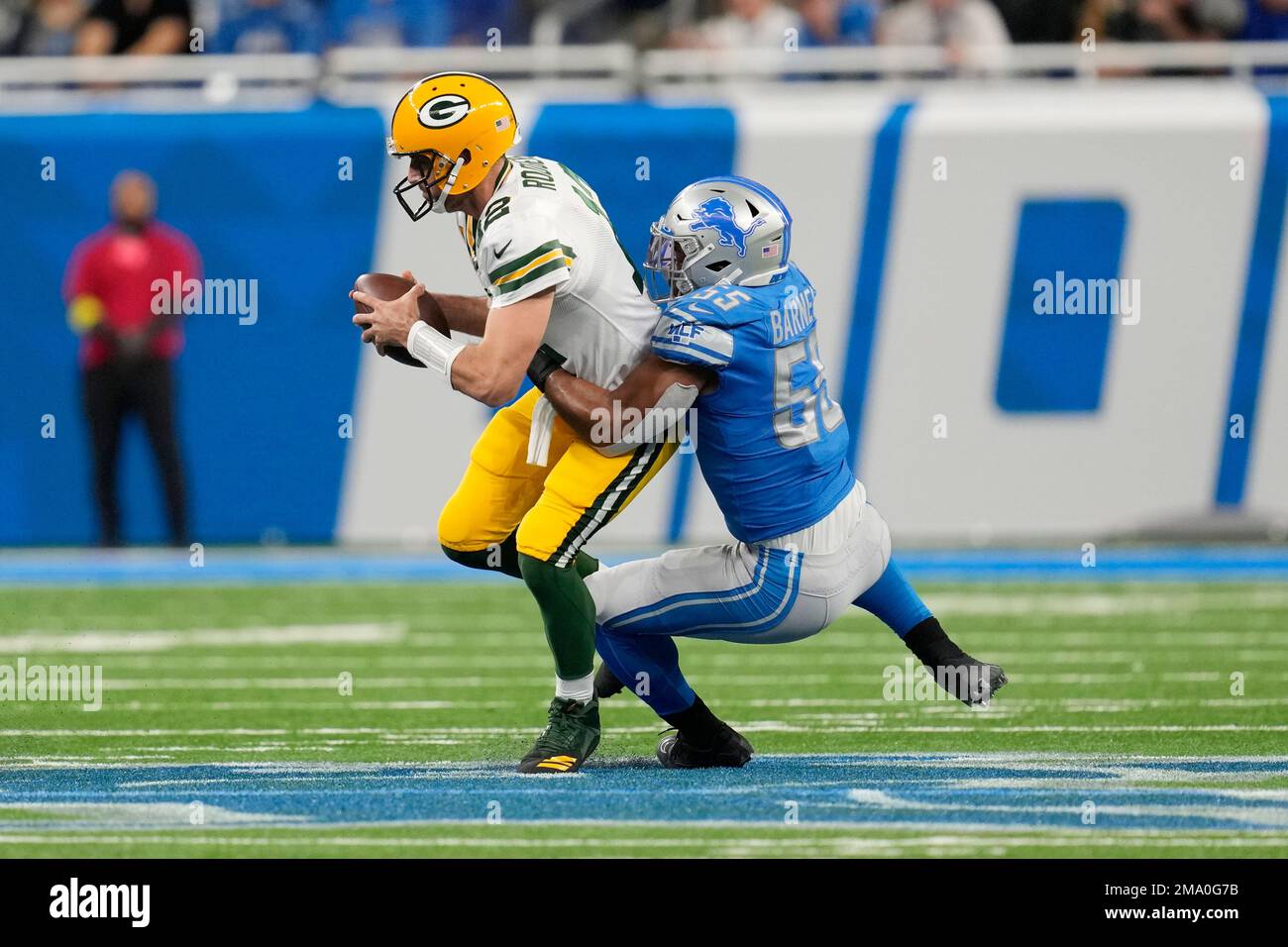 Green Bay Packers quarterback Aaron Rodgers (12) is sacked by Detroit ...