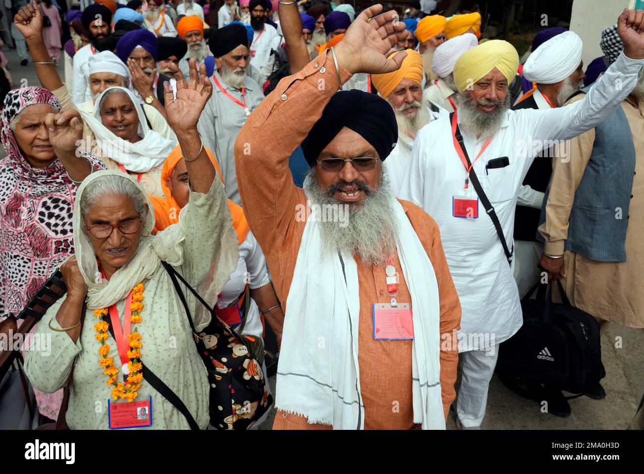 Indian Sikh pilgrims wave to journalists while entering Pakistan ...