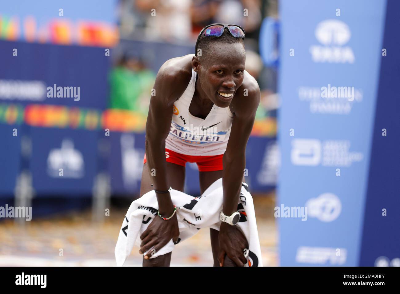 Lonah Chemtai Salpeter, of Israel, reacts after crossing the finish ...