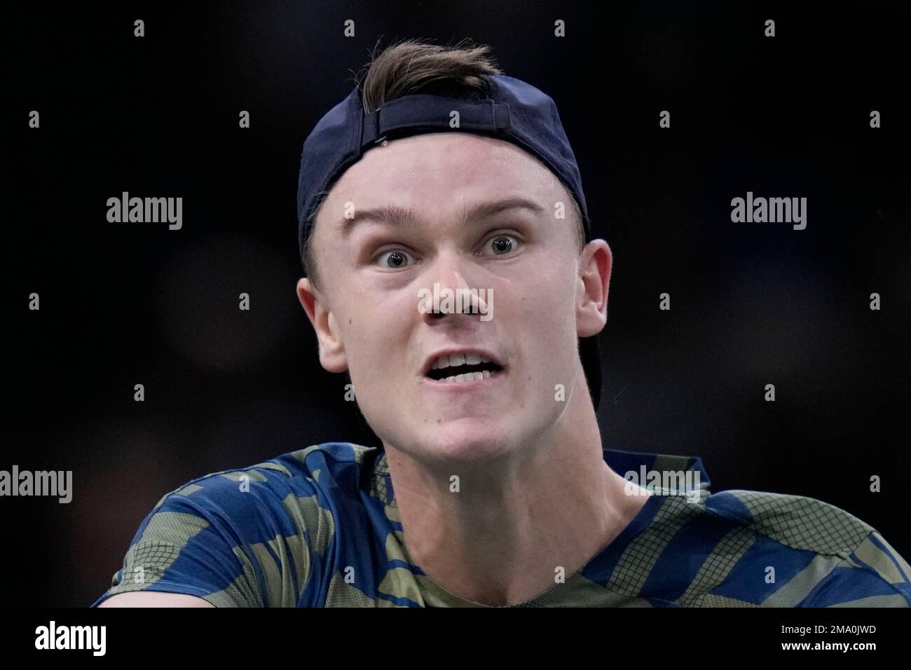 Denmark's Holger Rune grimaces as he plays Serbia's Novak Djokovic during their Paris Masters ...