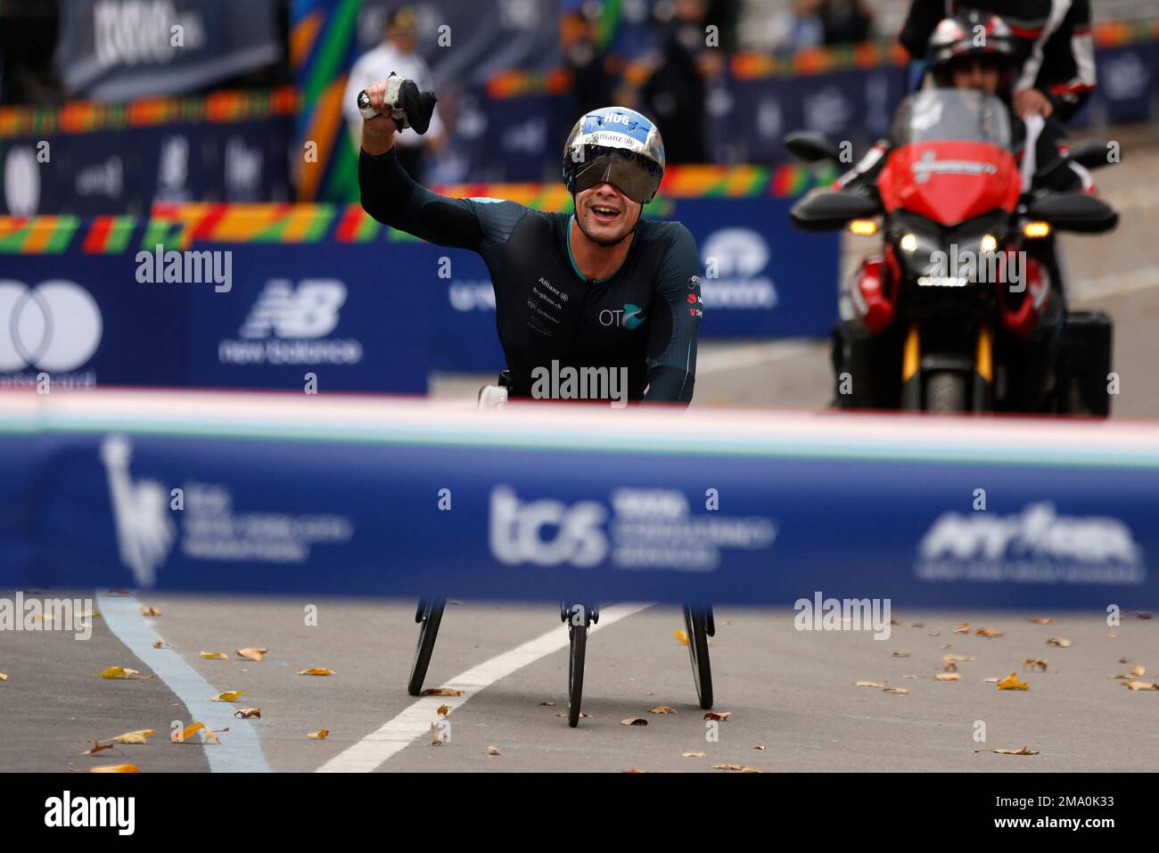 Marcel Hug of Switzerland celebrates before crossing the finish line ...