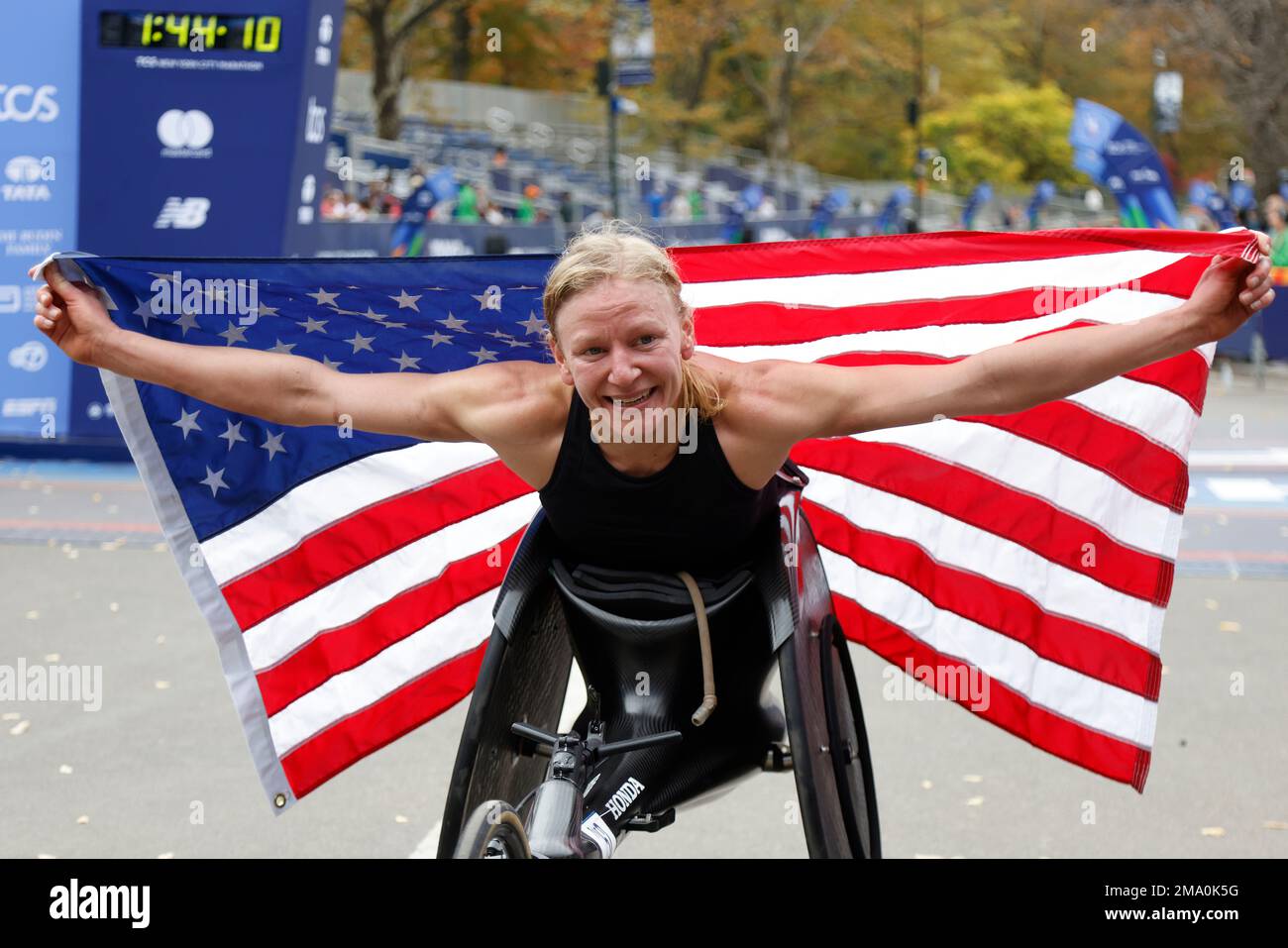 Susannah Scaroni celebrates after crossing the finish line first in the ...