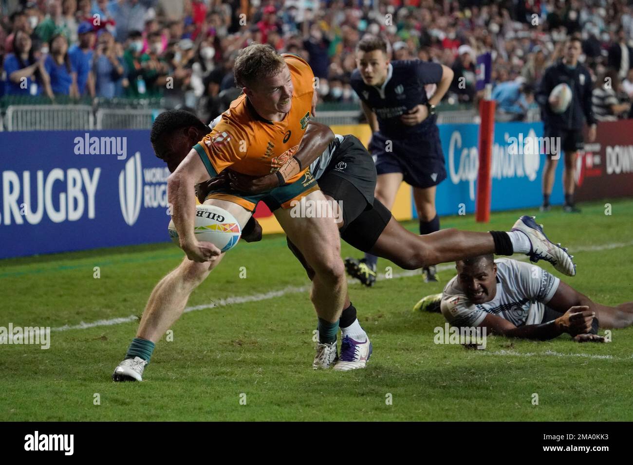 Australia's Henry Hutchison is tackled by Fiji's Joseva Talacolo during ...