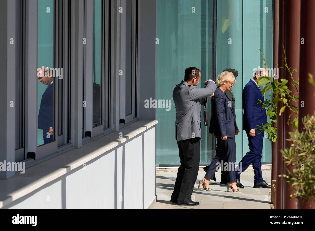 Cyprus' defense minister Charalambos Petrides, reflected on a window at ...
