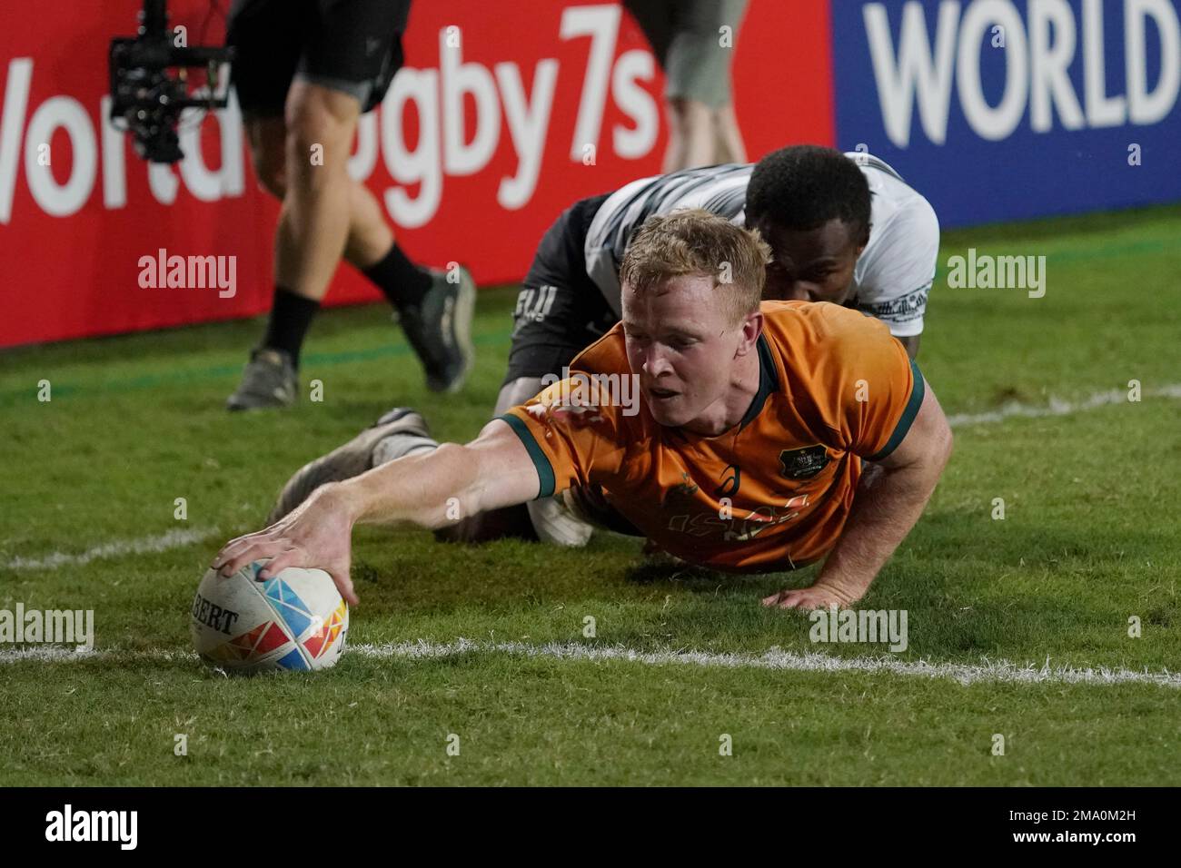 Australia's Henry Hutchison scores a try during the final match against ...