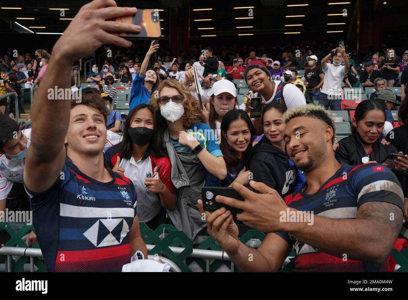 Hong Kong's Liam Doherty, left, and Max Denmark pose for selfies with ...