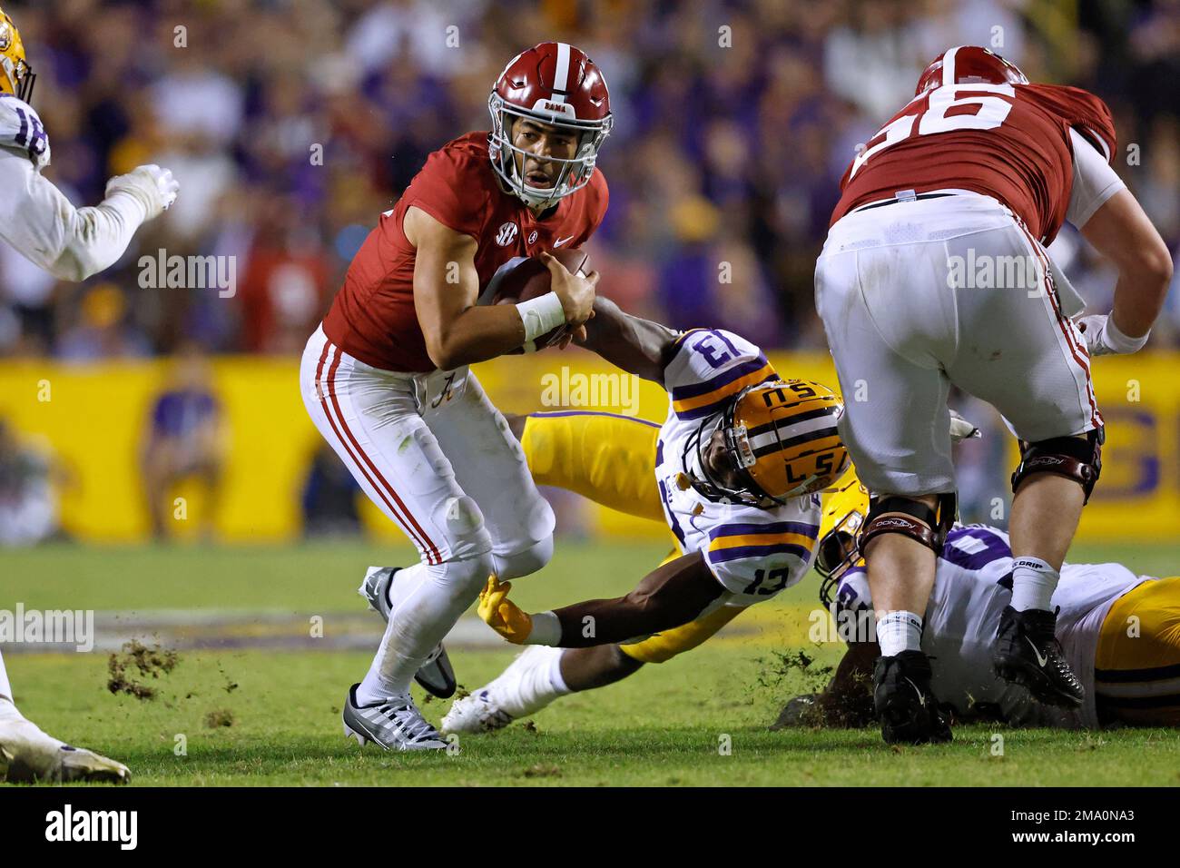 Alabama quarterback Bryce Young is defended by LSU safety Joe Foucha ...