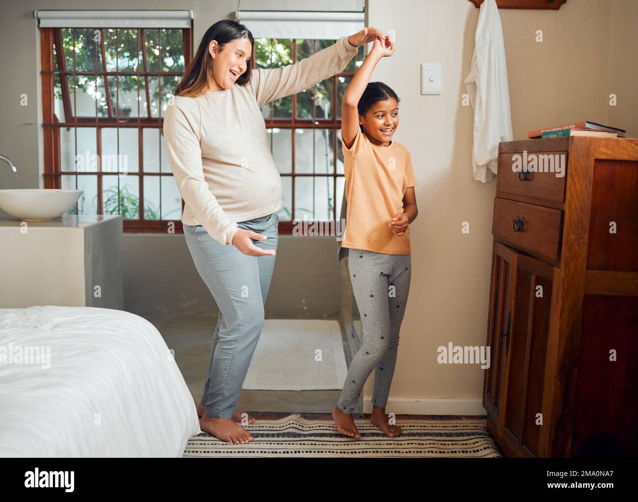 Pregnant mother, child and happy family dancing in home bedroom for ...
