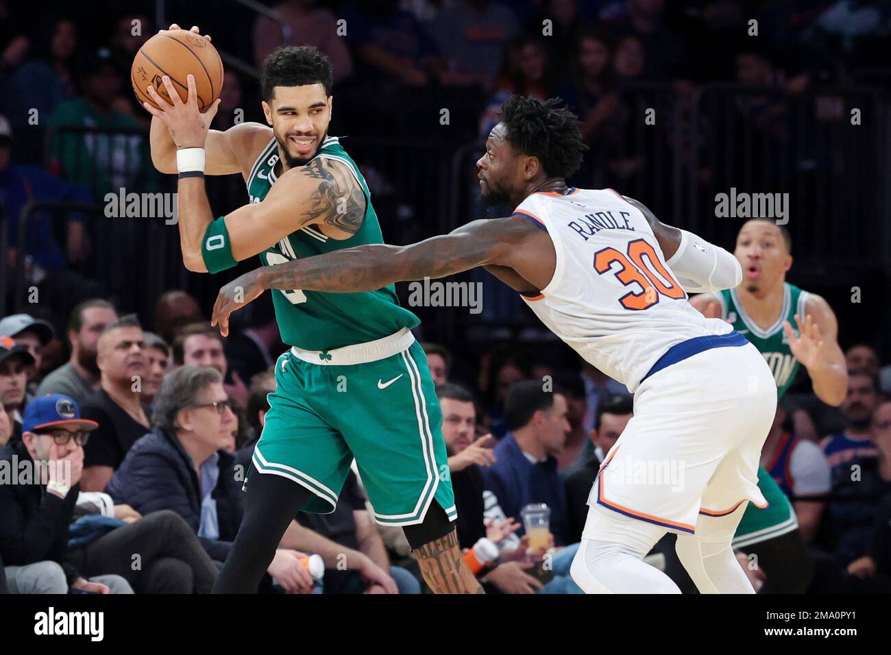 Boston Celtics forward Jayson Tatum shields the ball from New York ...